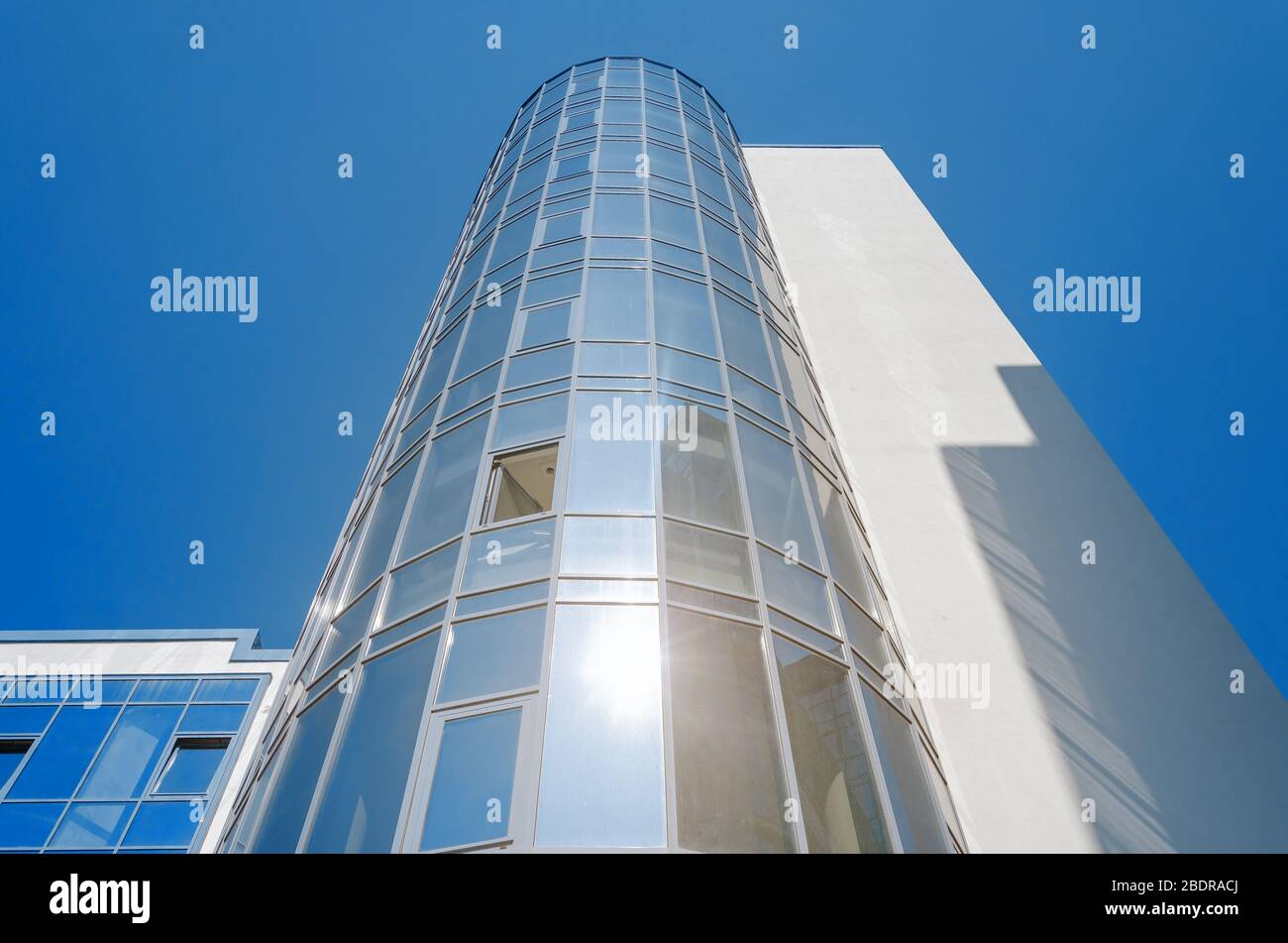 Modern office building in blue glass Stock Photo - Alamy