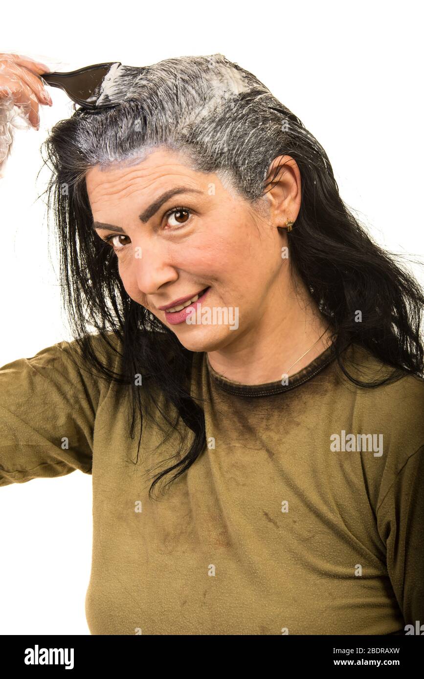 Woman changing hair color against white background Stock Photo - Alamy
