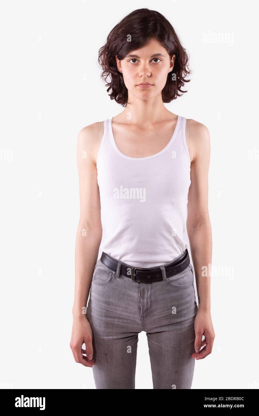 Caucasian girl standing straight, looking directly at camera. White ...