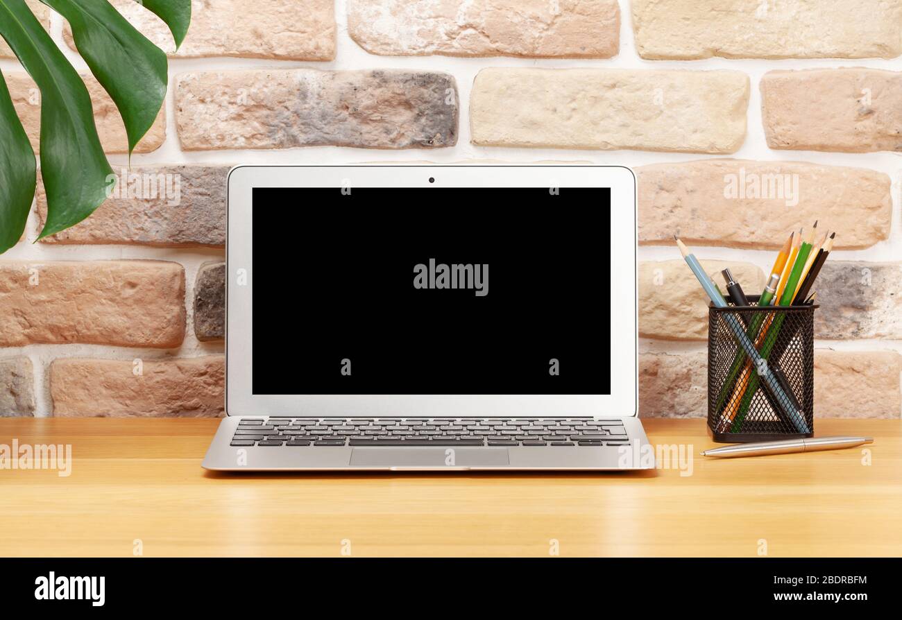 Stylish home studio workspace with laptop computer and supplies. Work ...