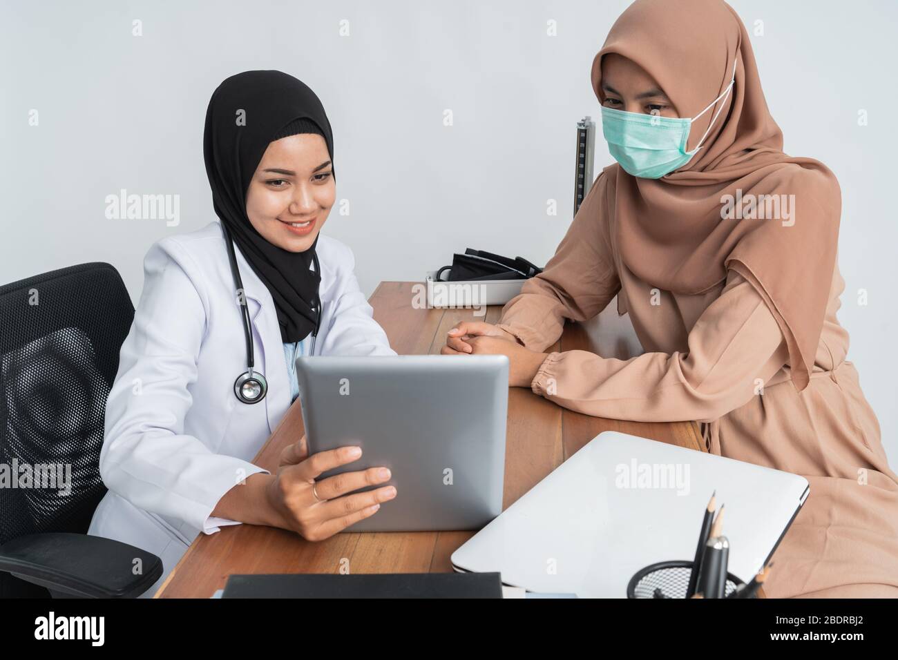 muslim patient during medical check up with doctor wearing masks Stock ...