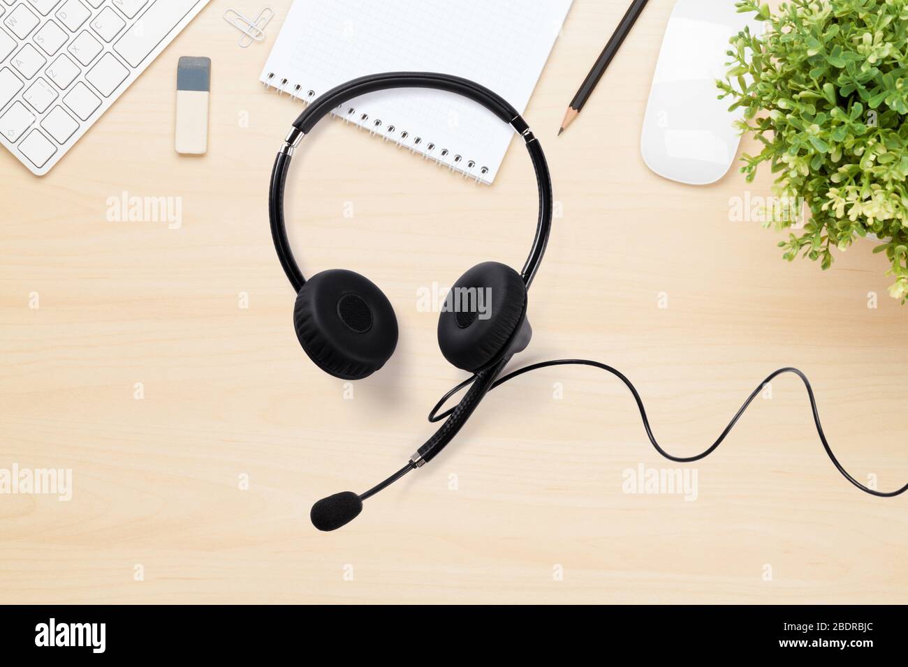 Office wooden workplace backdrop with supplies, headset and computer ...