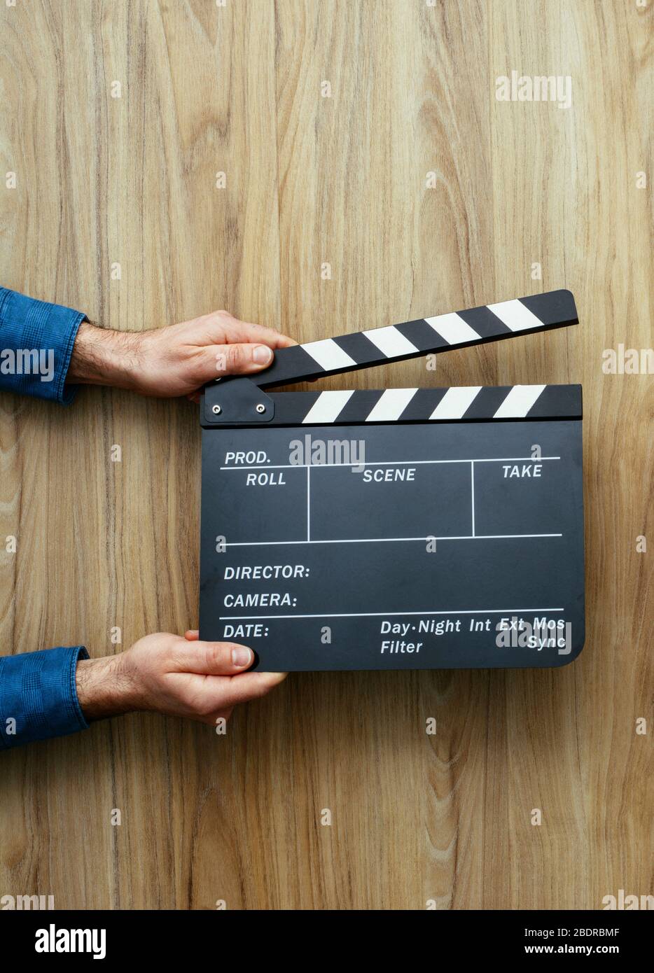 Film director holding a clapper board, filmmaking and cinema concept ...