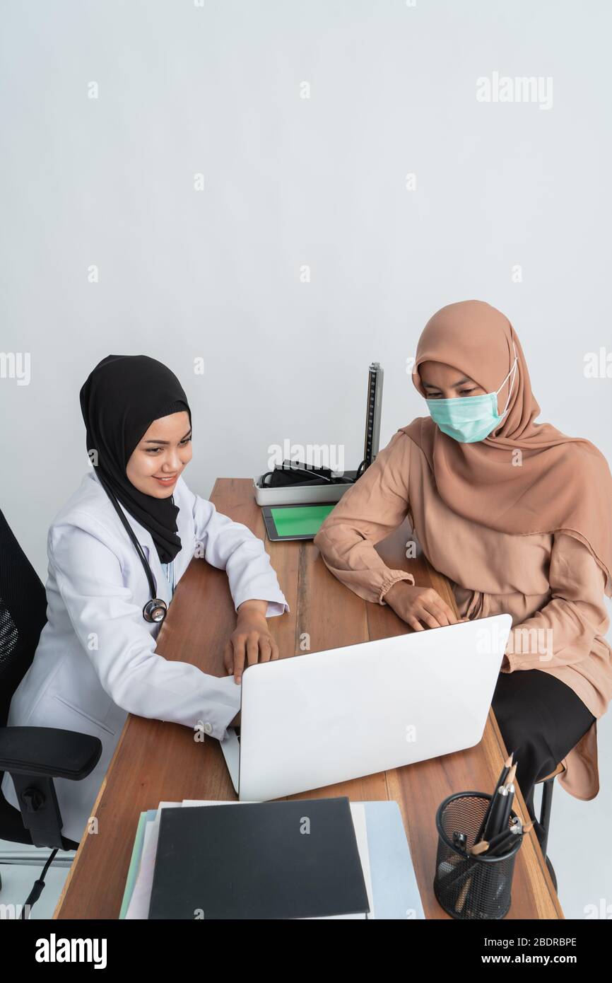 muslim woman hijab consultation with doctor specialist in the office Stock Photo - Alamy