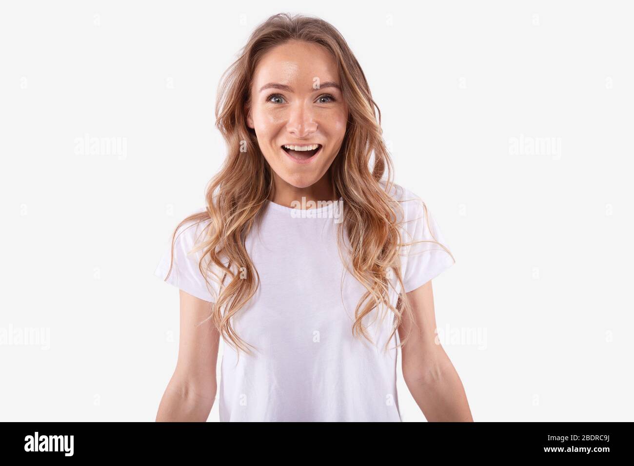 Young caucasian woman pleasantly surprised, joyfully smile. Amazing ...