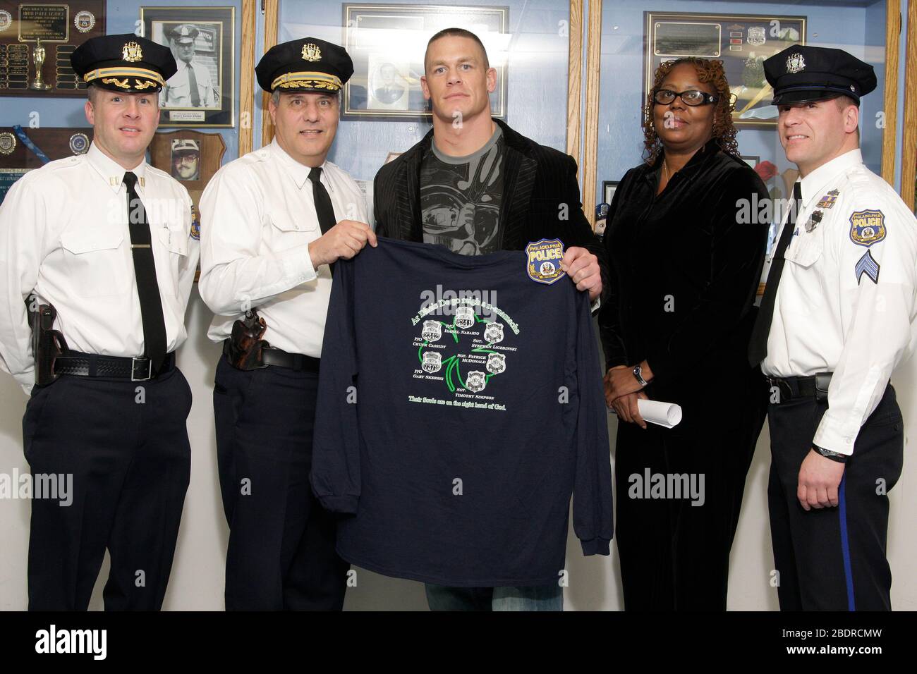 Pictured presenting a shirt to actor John Cena are Captain Dennis ...
