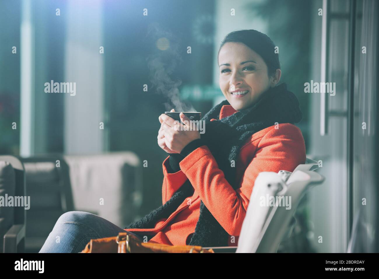 Attractive woman relaxing at the cafe and drinking an hot coffee Stock ...
