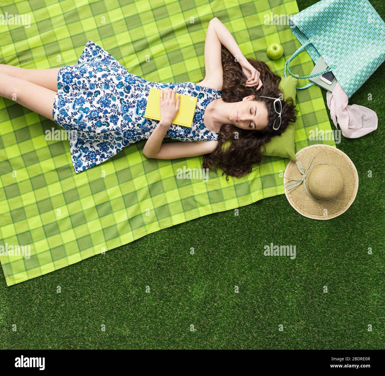 Girl napping on grass hi-res stock photography and images - Alamy