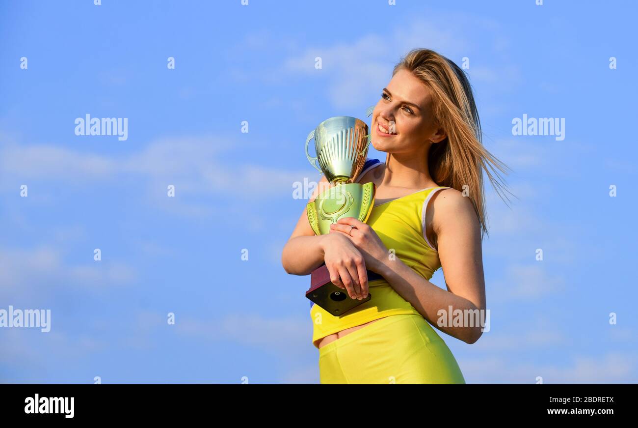 Woman athlete holding trophy hi-res stock photography and images - Alamy