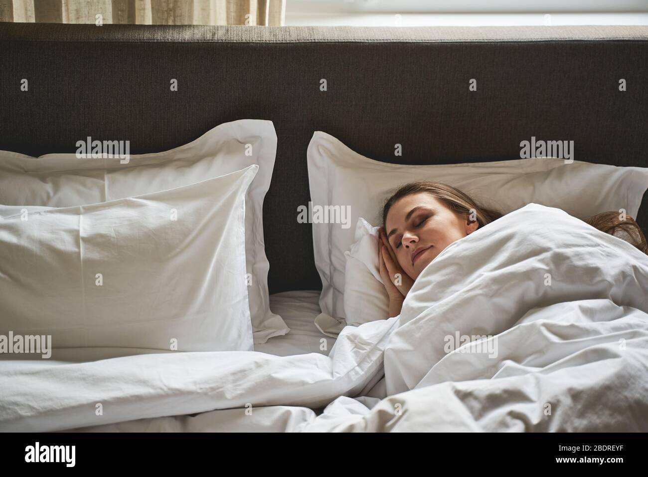 Modern tranquil pretty young lady sleeping peacefully Stock Photo - Alamy