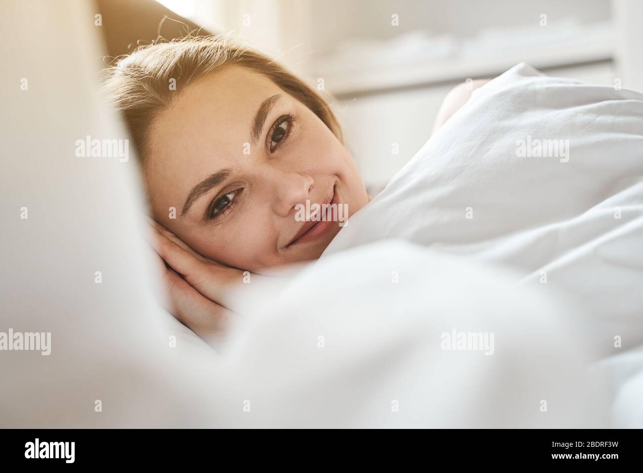 Cute girl looking in front of her Stock Photo - Alamy