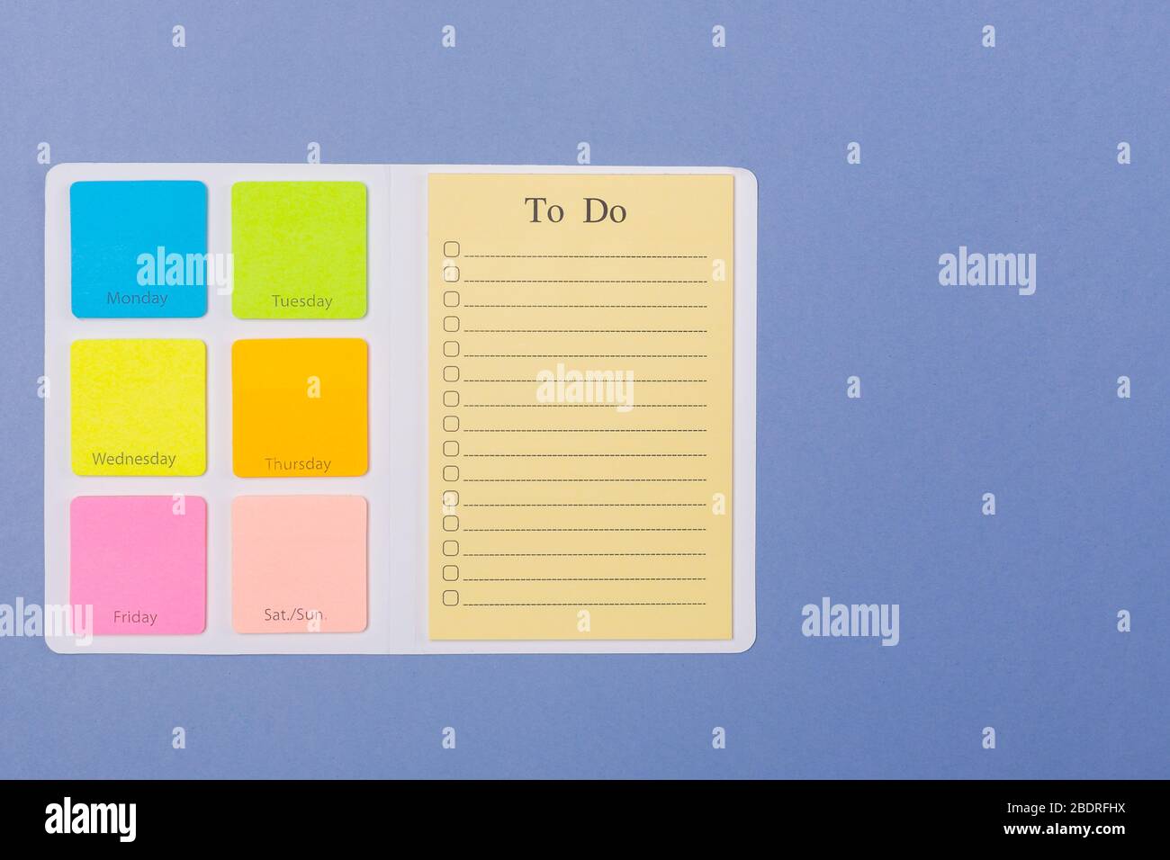 Close- up of Blank To do list for the week on light purple background ...