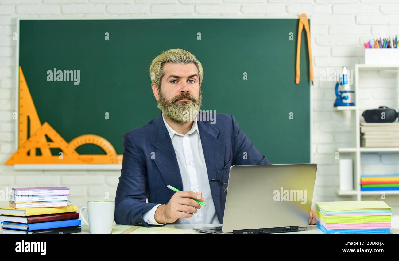 Providing useful information. Bearded man teach information at school ...