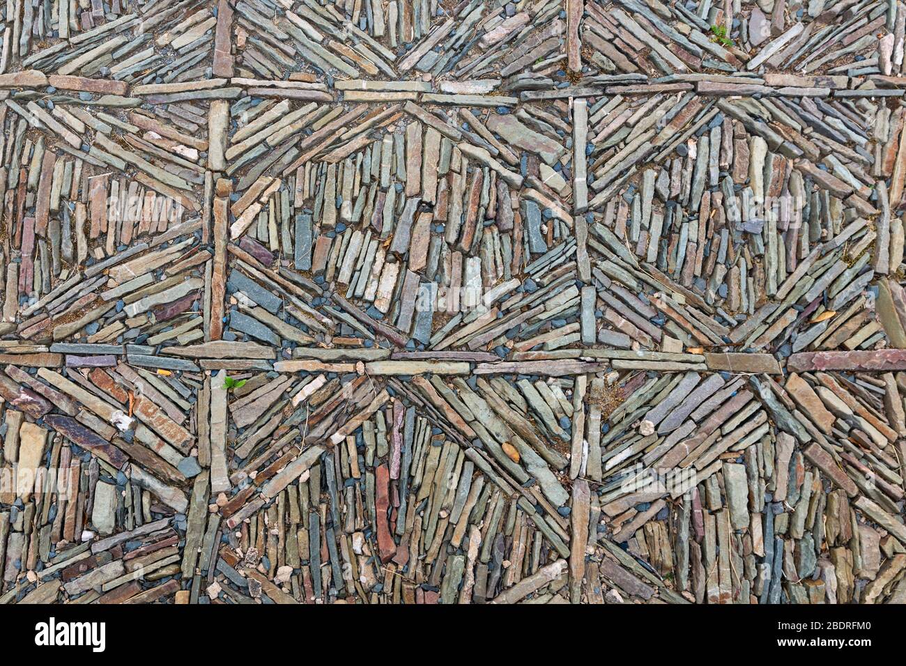 Pavement background symmetry of colorful slate stones Stock Photo - Alamy