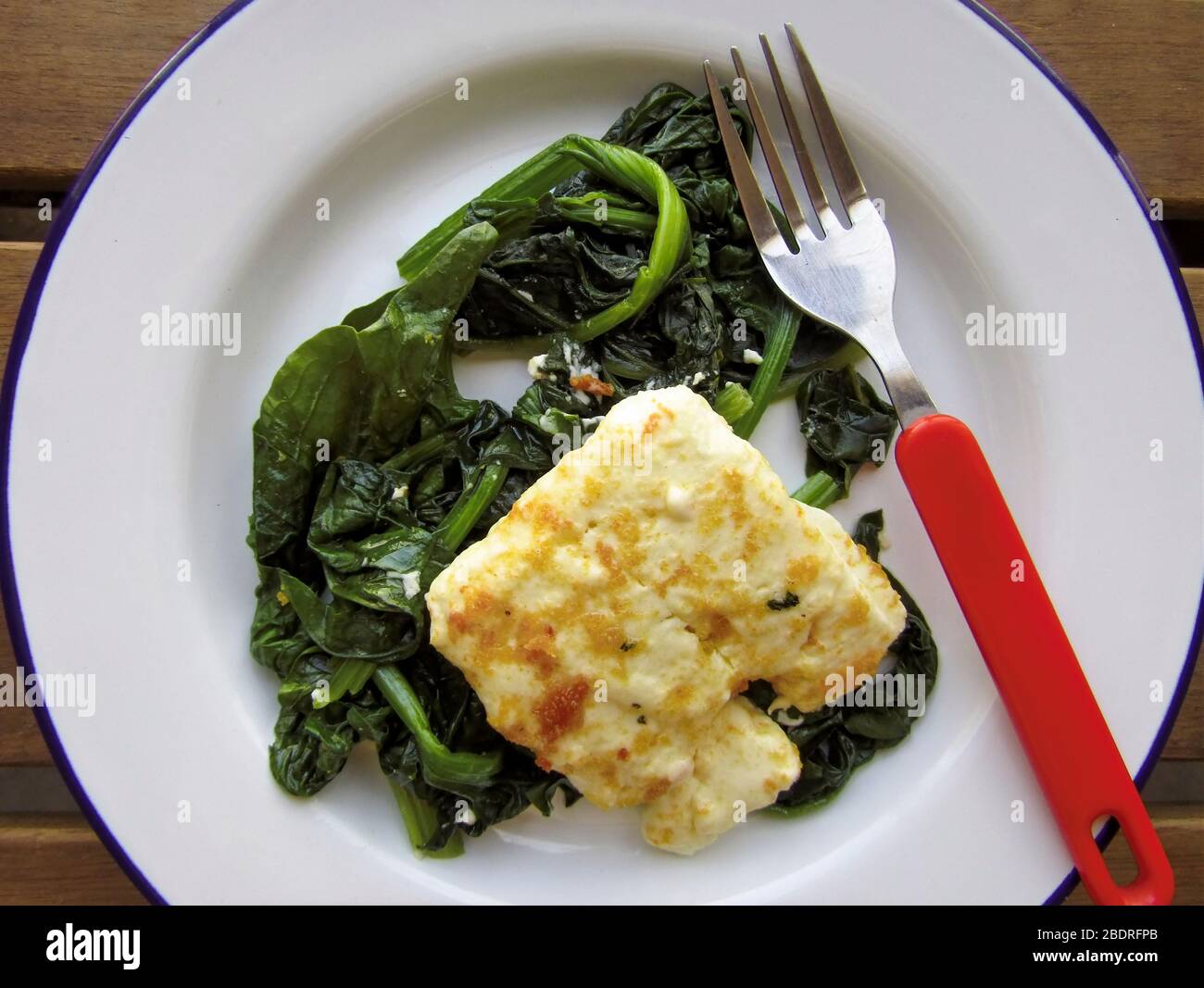 Greek Cuisine. Fried Feta Saganaki with Spinach, Crete, Greece Stock ...