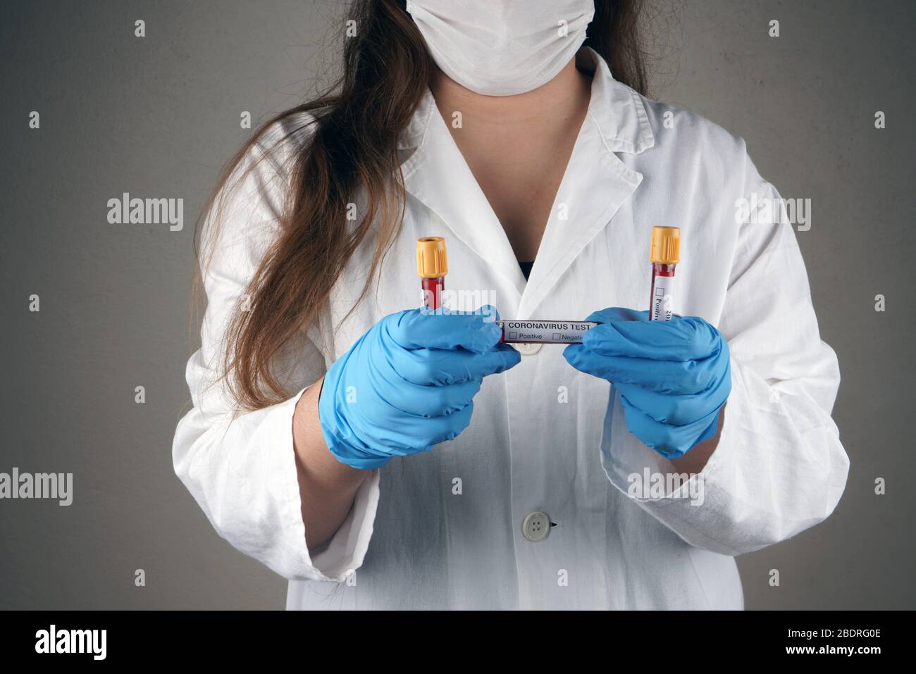 Doctor with horizontal and vertical blood tubes in hand Stock Photo - Alamy