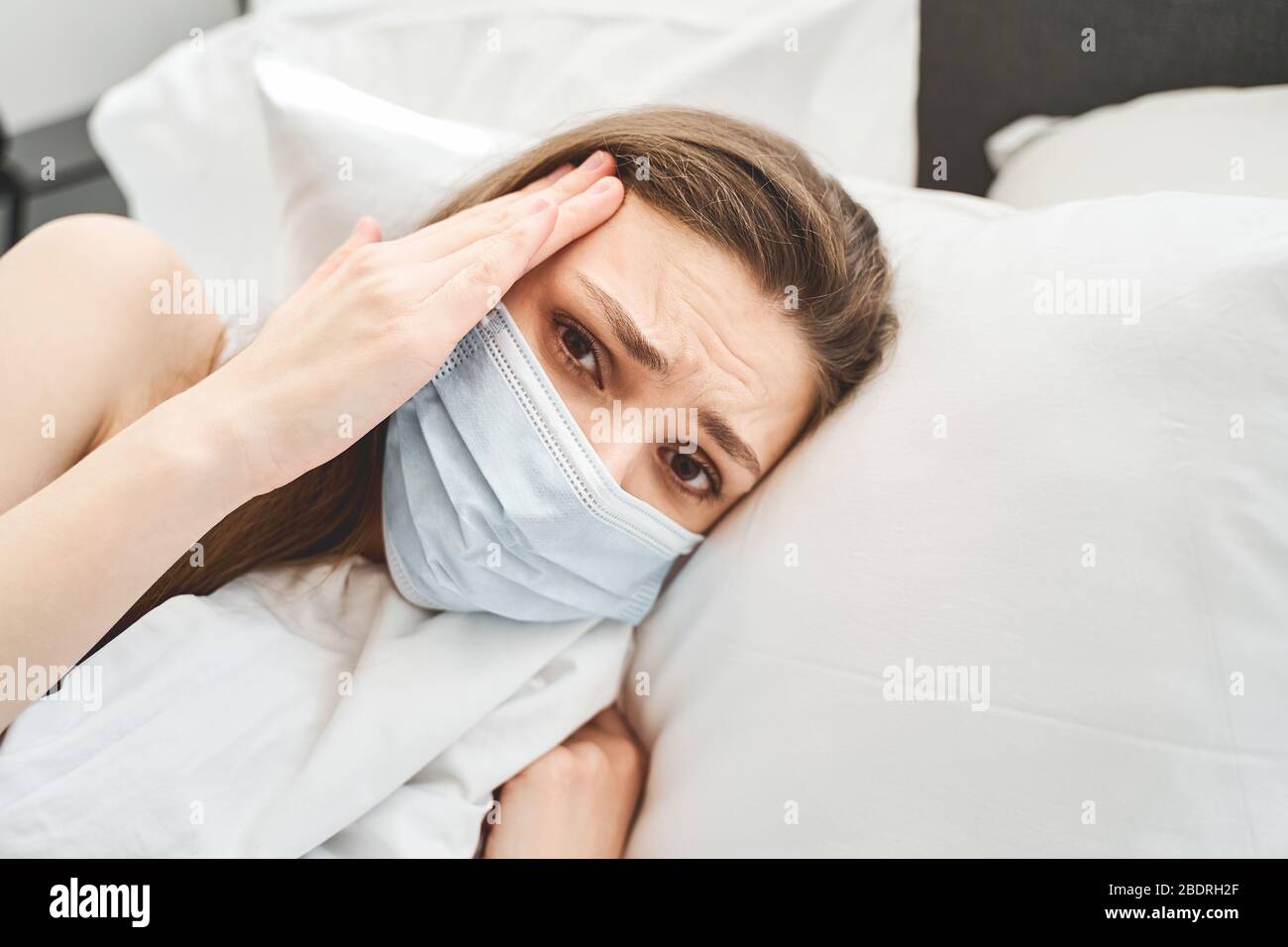 Female patient suffering from a viral infection Stock Photo - Alamy