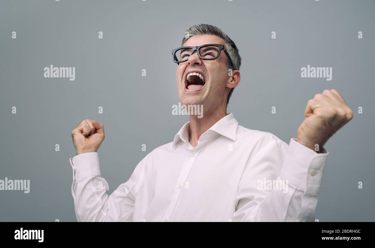 Man celebrating success shouting hi-res stock photography and images ...
