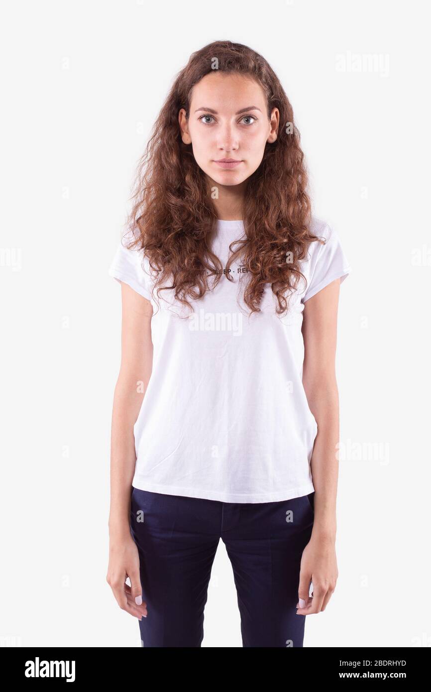 Caucasian girl standing straight, looking directly at camera. White ...