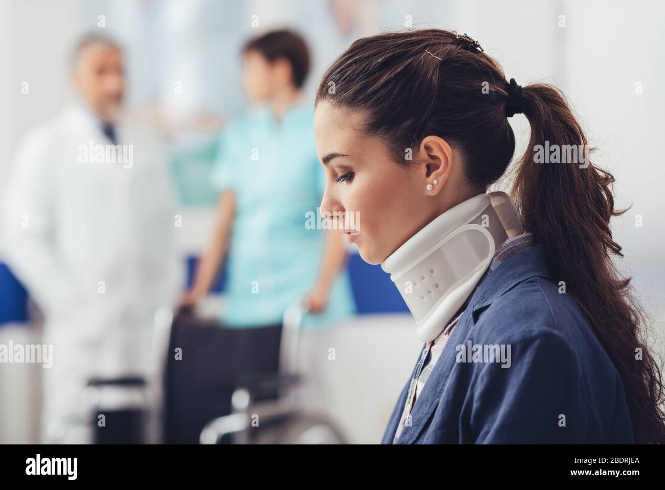 Young female patient with cervical collar support at the hospital, she ...