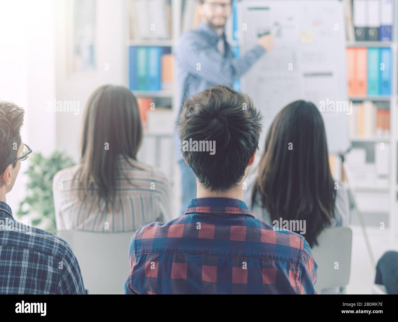 Business presentation in the office: a man is explaining a project on a ...