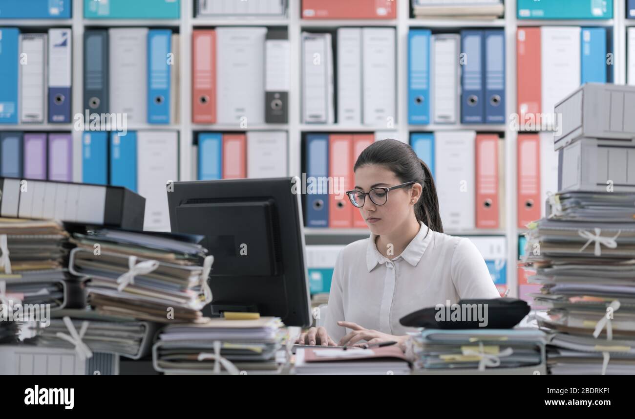 Woman office desk piles of paperwork hi-res stock photography and ...