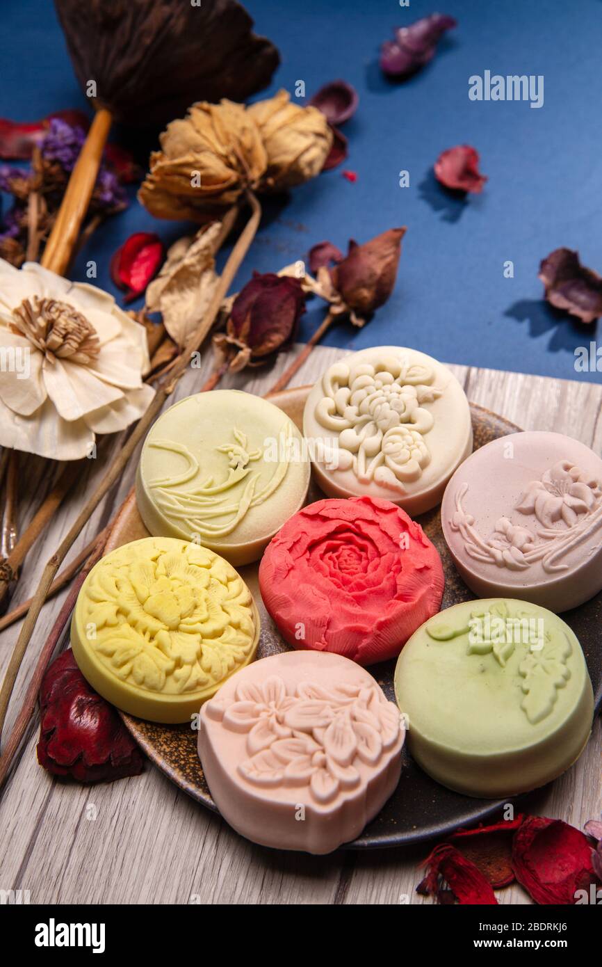 Moon cake with dried flower close-up Stock Photo - Alamy