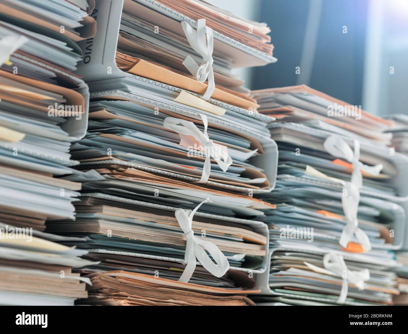 Stacks of paperwork and files in the office: work overload, files ...