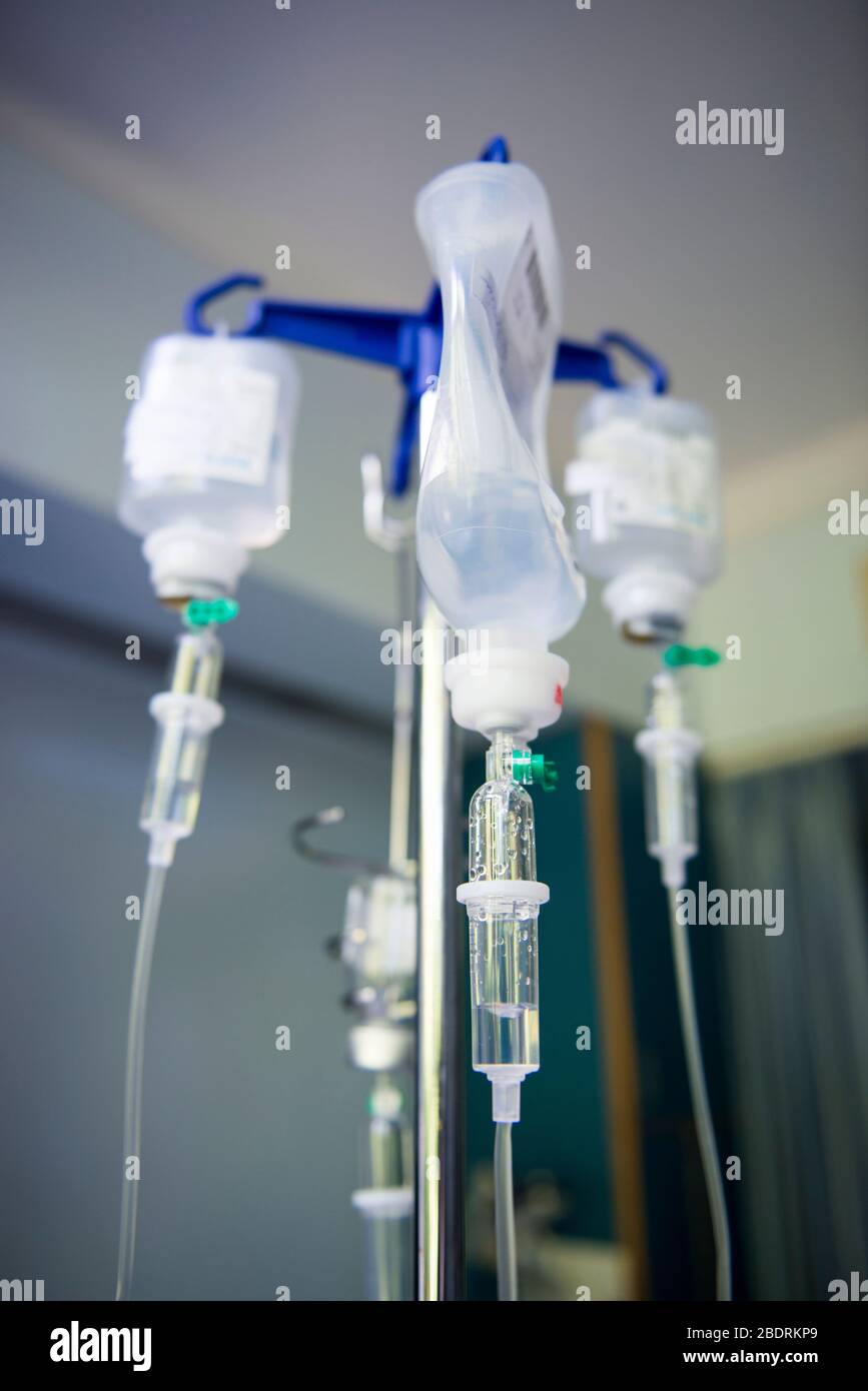 Saline drip support stand. Bottle with solution for intravenous ...