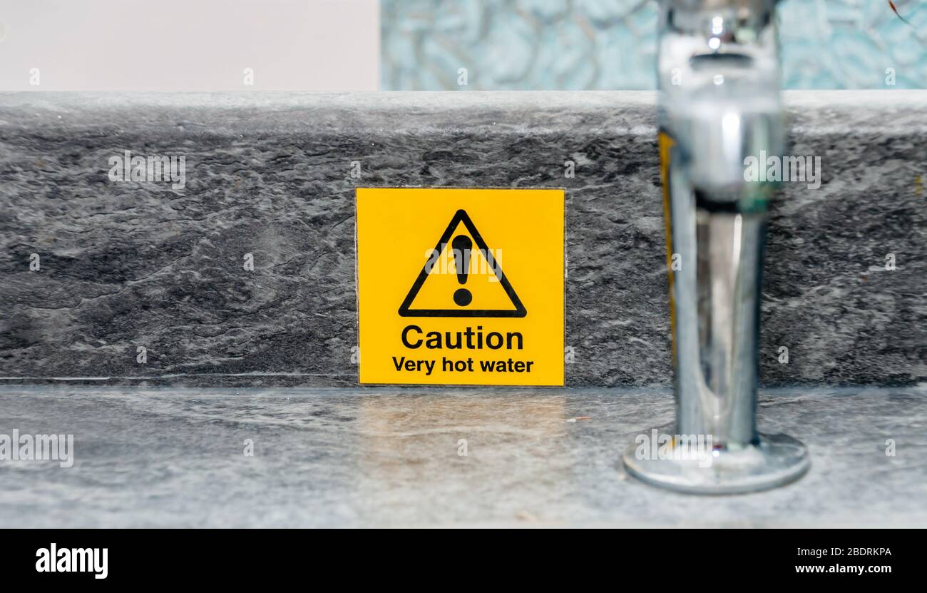 Health and Safety. Yellow and Black safety sign Caution Very Hot Water ...