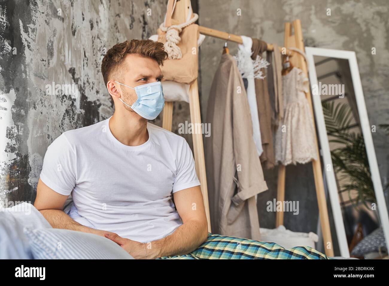 Concentrated brunette male being deep in thoughts Stock Photo - Alamy