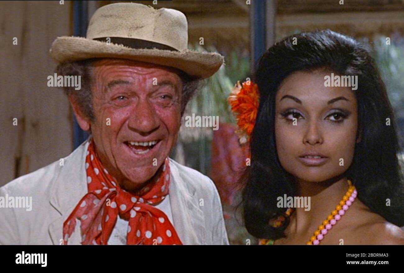 London.UK. Shakira Caine (then Shakira Baksh), Sid James in a scene in ...