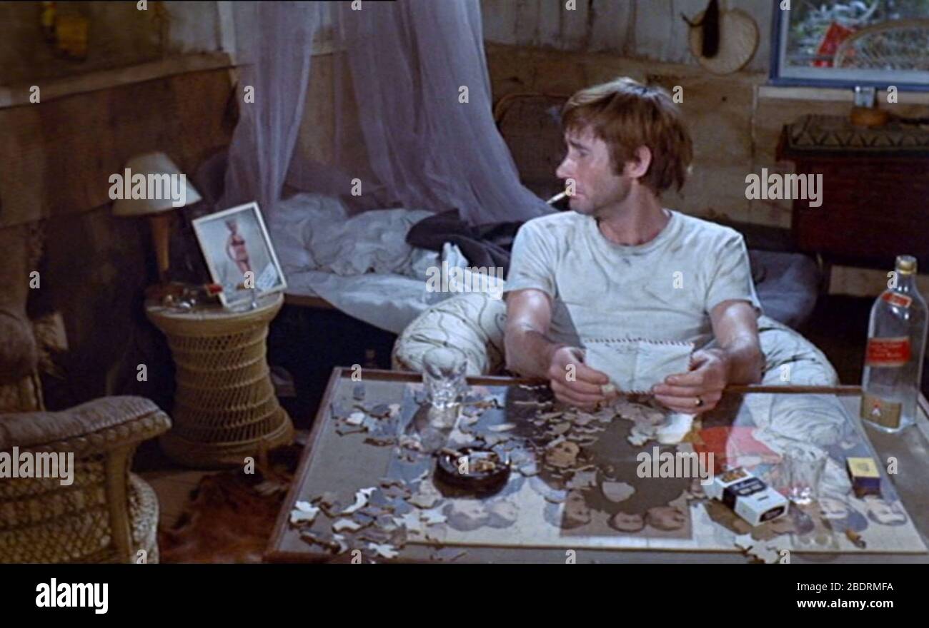 London.UK. Barbara Windsor (in a photo) and Jim Dale in a scene in ...