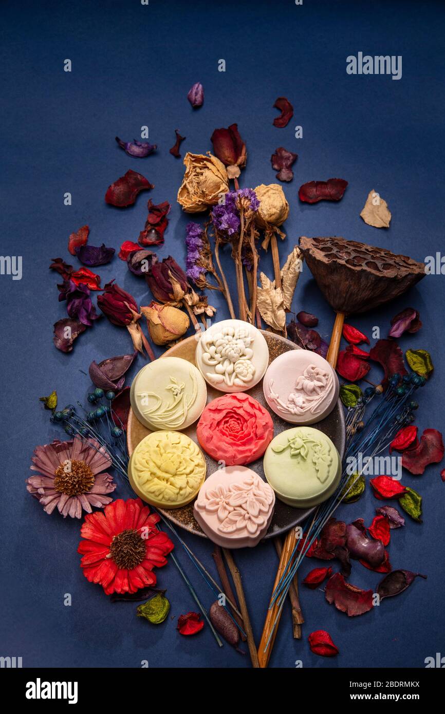 Moon cake with dried flower close-up Stock Photo - Alamy