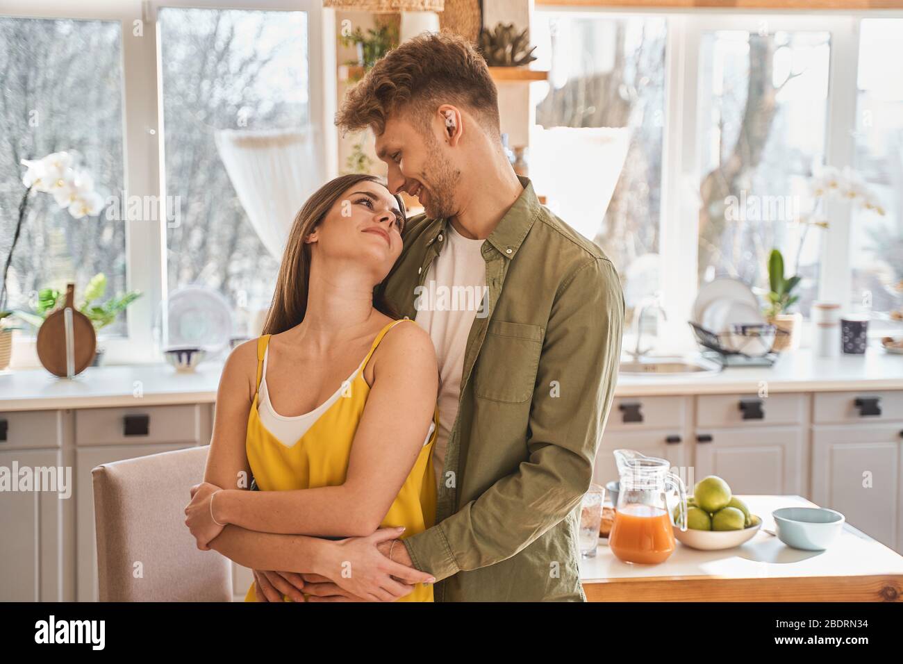 Kind brunette female looking at her man Stock Photo - Alamy
