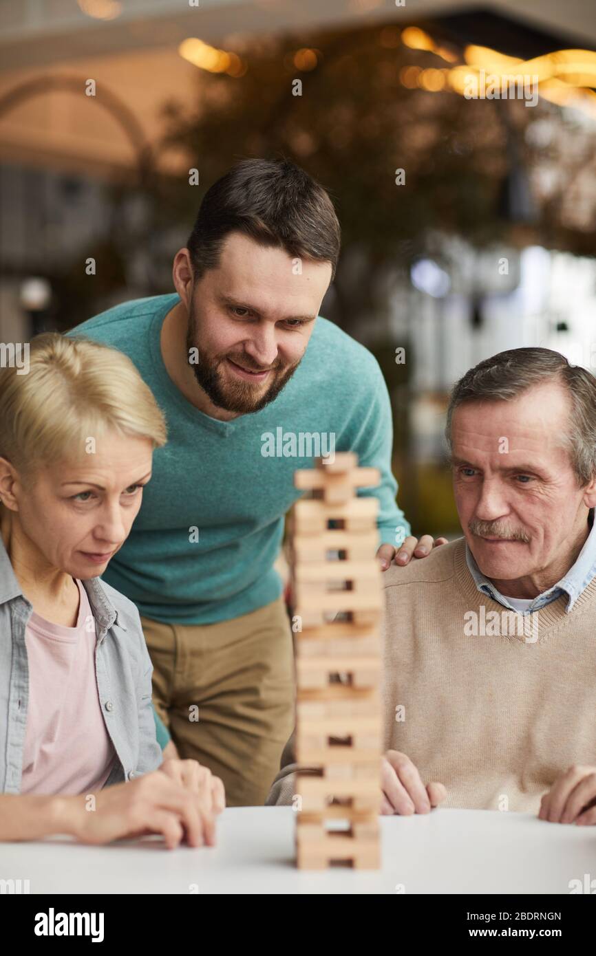 Caucasian family playing jenga hi-res stock photography and images - Alamy