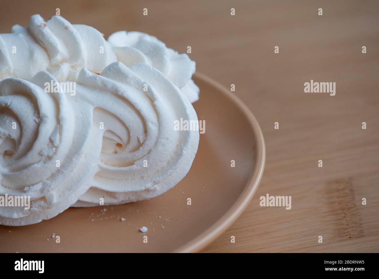 Light textured white meringue shells dot surface. Meringue cake Stock ...