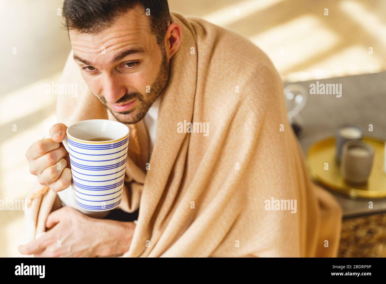 Sick man wrapped in hi-res stock photography and images - Alamy