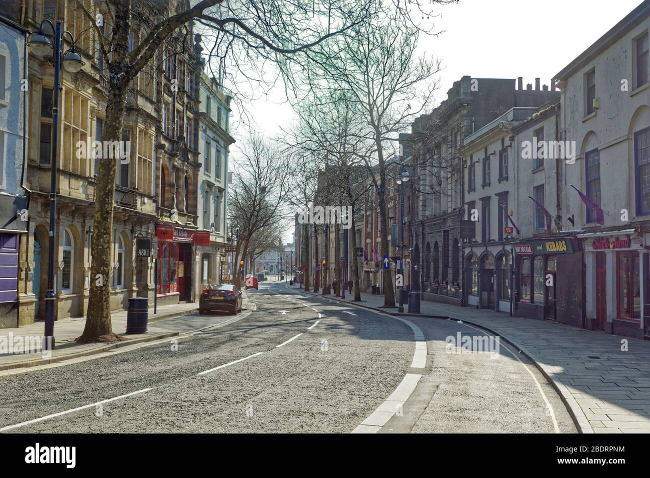 Pictured: Wind Street in the deserted Swansea city centre, Wales, UK ...