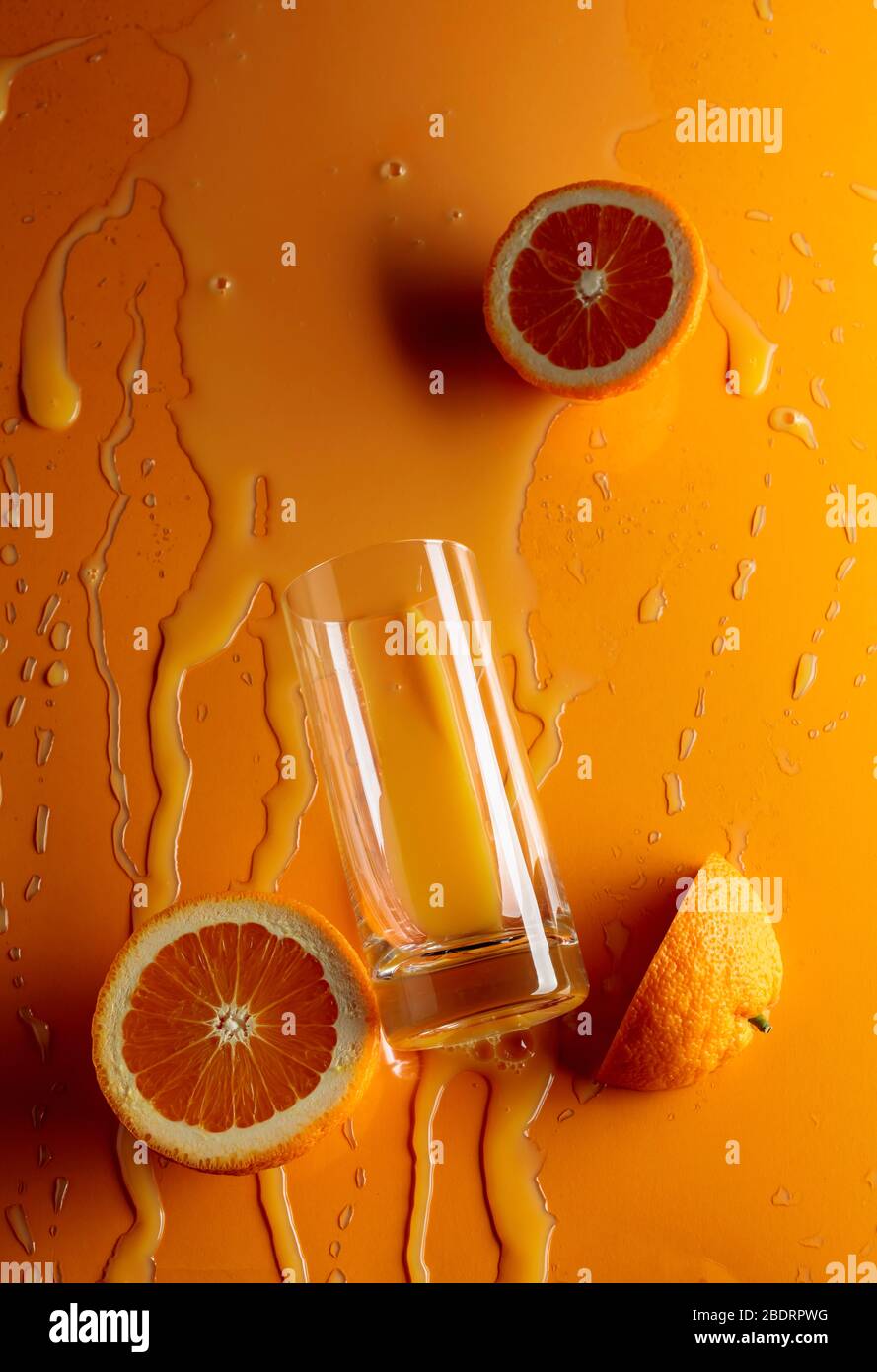 Orange juice with fruits on a orange background. Top view Stock Photo ...