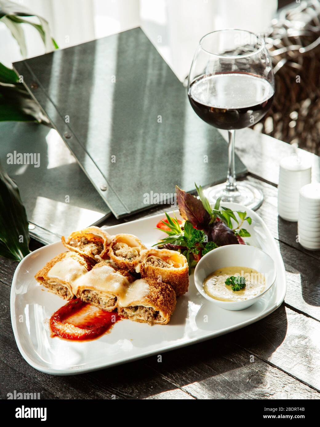 crispy fried crepes stuffed with minced meat and herb garnished with ...