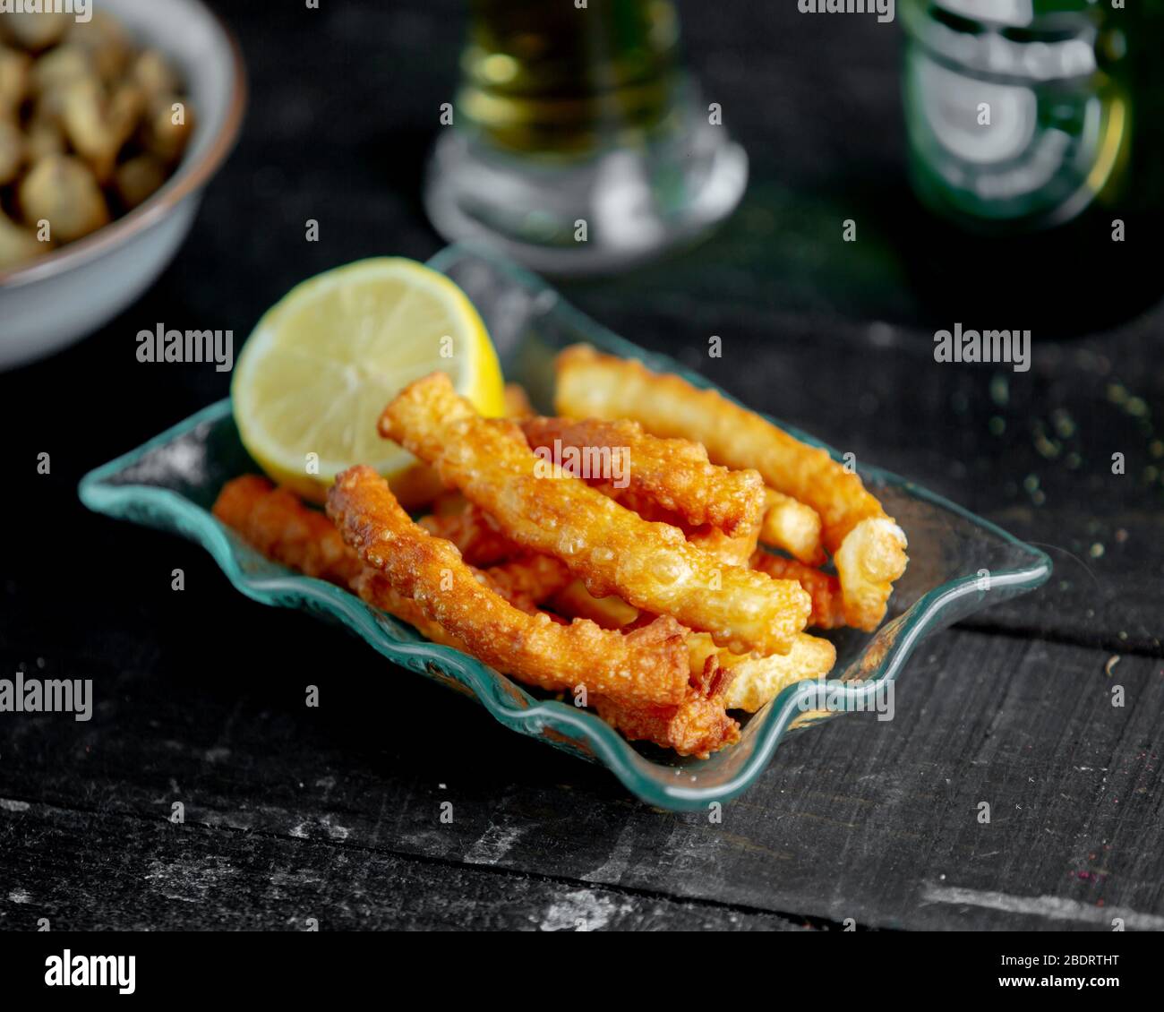 fried finger cheese serving and lemon half Stock Photo - Alamy
