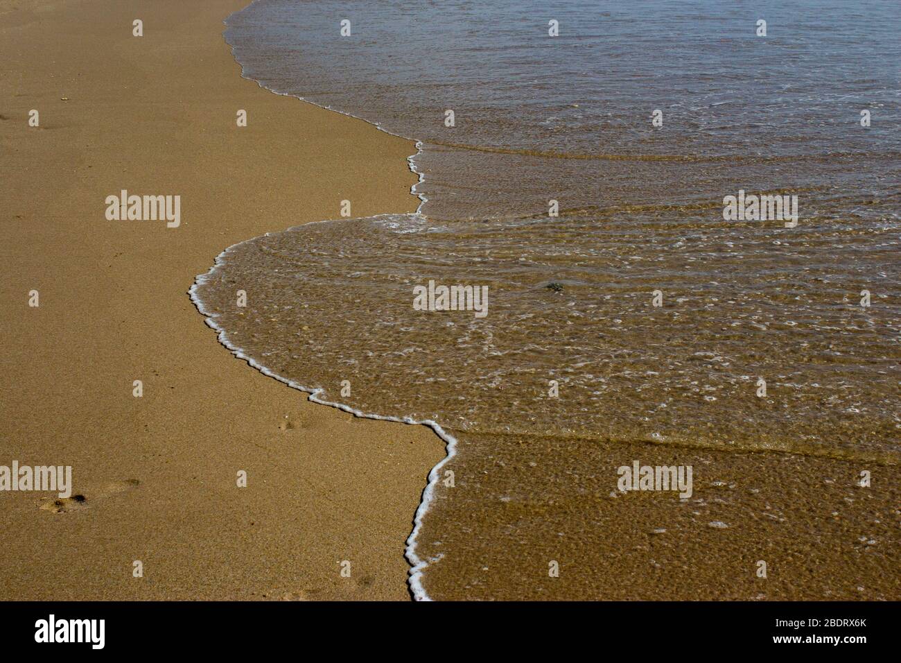 Receding wave on a Florida Beach Stock Photo - Alamy