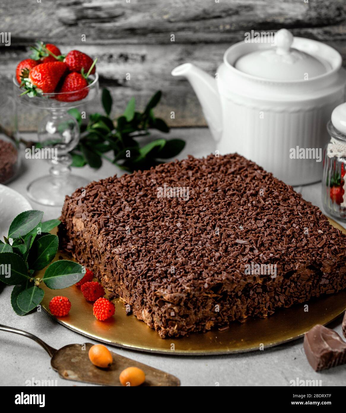 square cake covered with chocolate pieces Stock Photo - Alamy