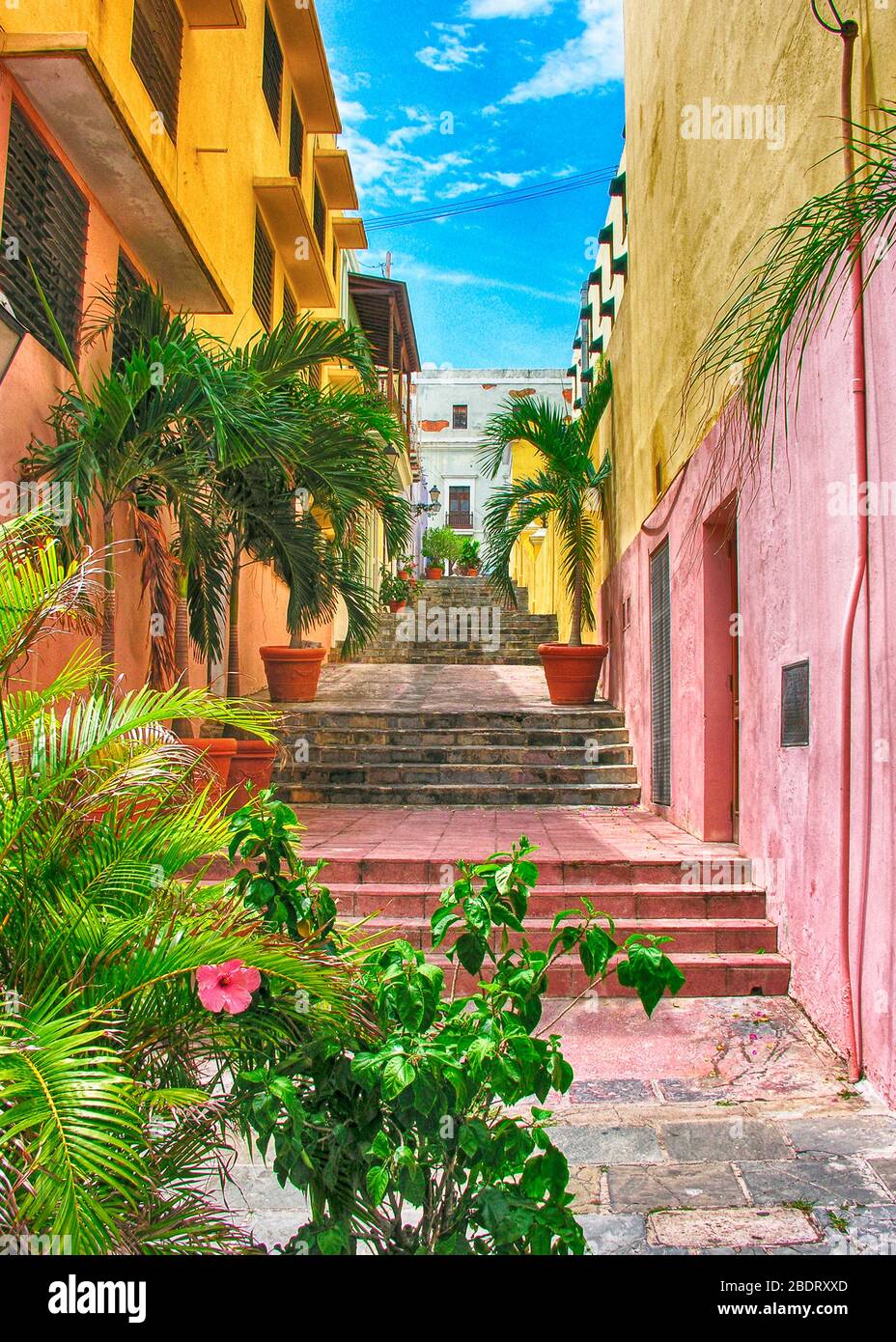 Beautiful, colorful walkway with stairs between two buildings in Mexico ...