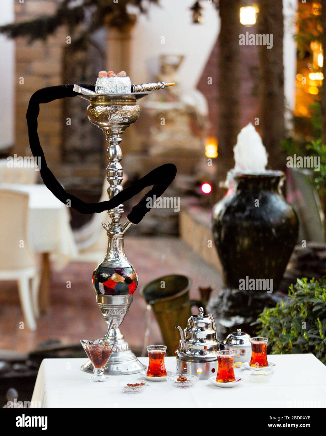 tea and hookah setup served with jam bowl Stock Photo - Alamy