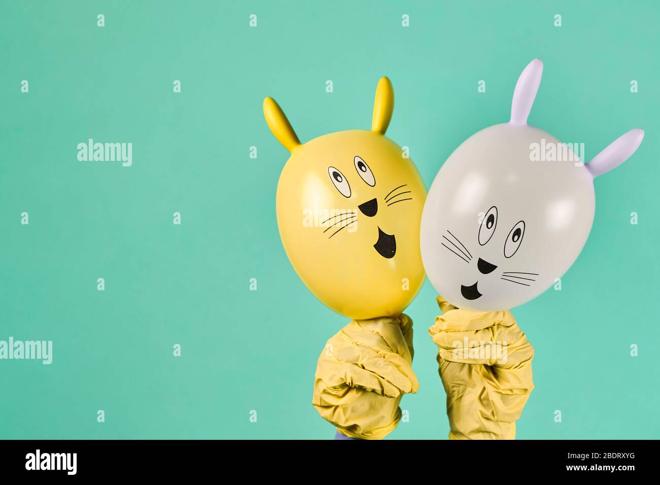 Female hands in medical-surgical gloves holding cute Easter bunny ...