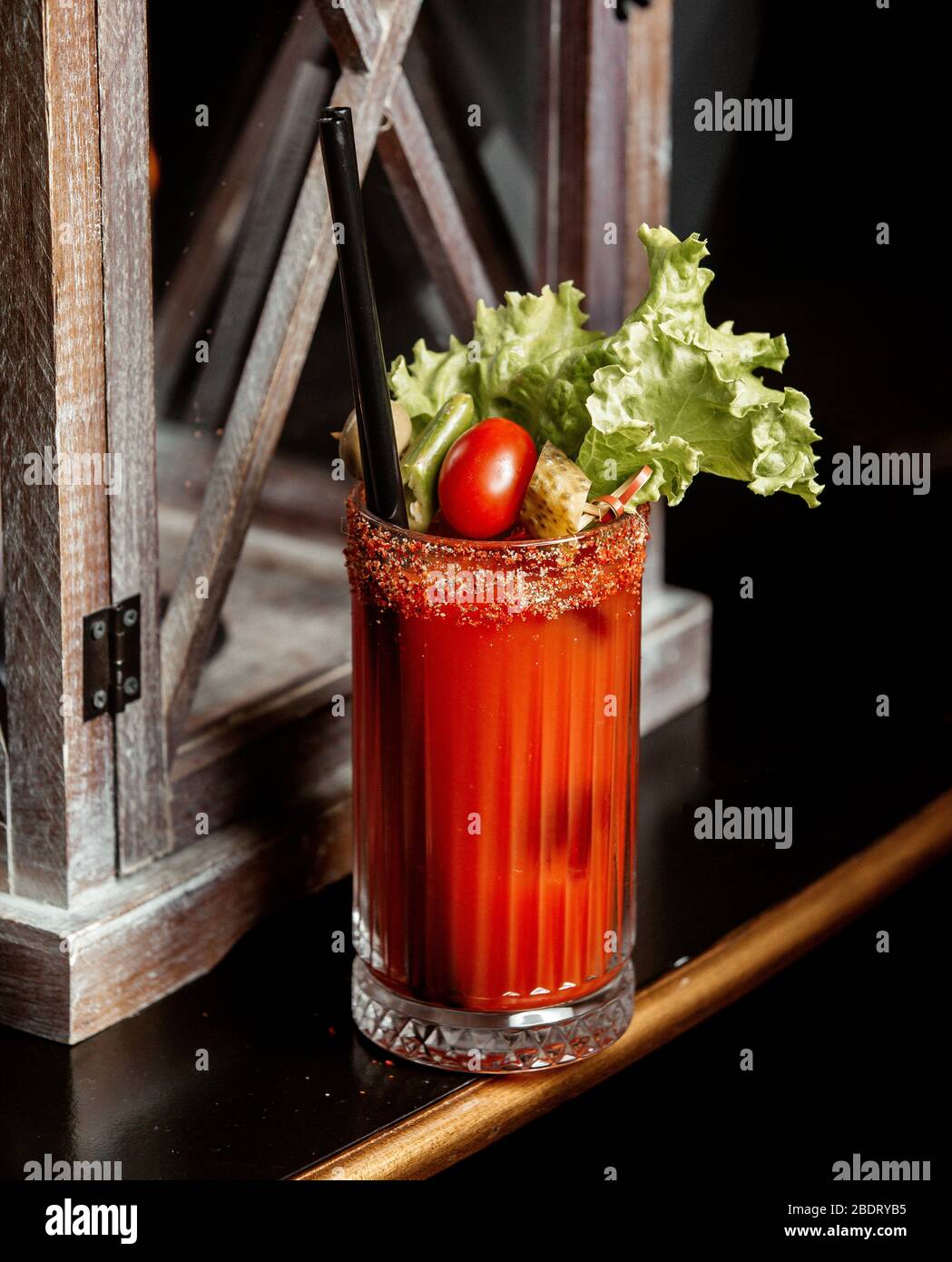 tomato cocktail garnished with lettuce cucumber pickle pepper and ...
