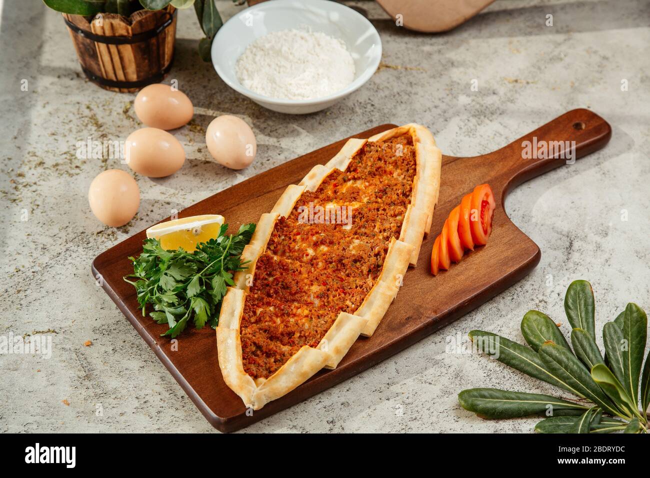 turkish pide flatbread with minced meat and tomato topping Stock Photo ...