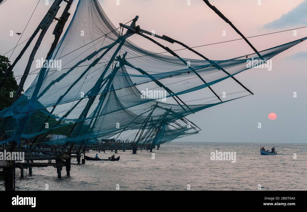 The famous chinese fishing (Cheena vala) nets at sunset in the estuary ...